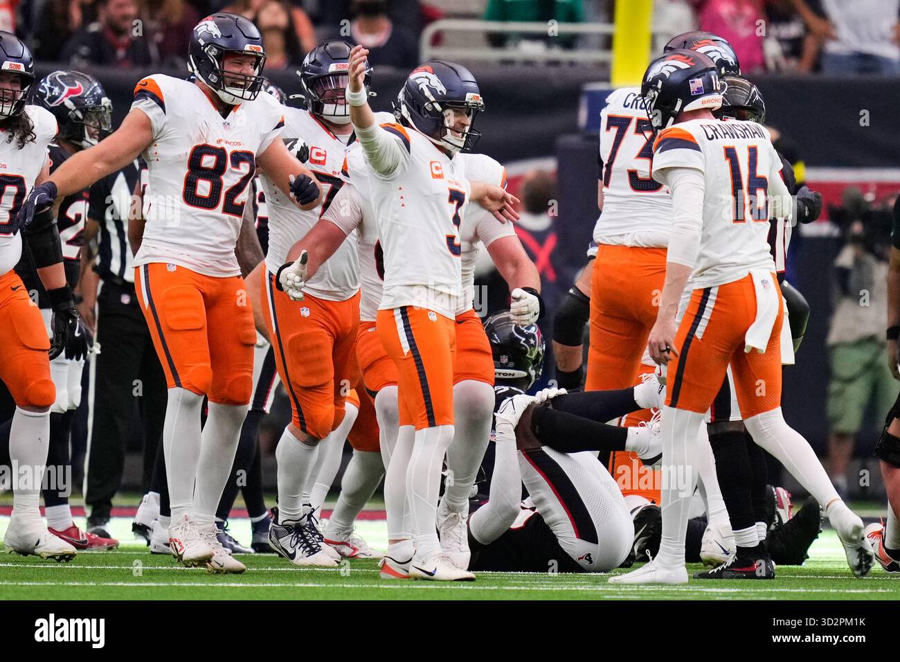 Denver Broncos' Adam Trautman (82), Wil Lutz (3) and Jeremy Crawshaw ...
