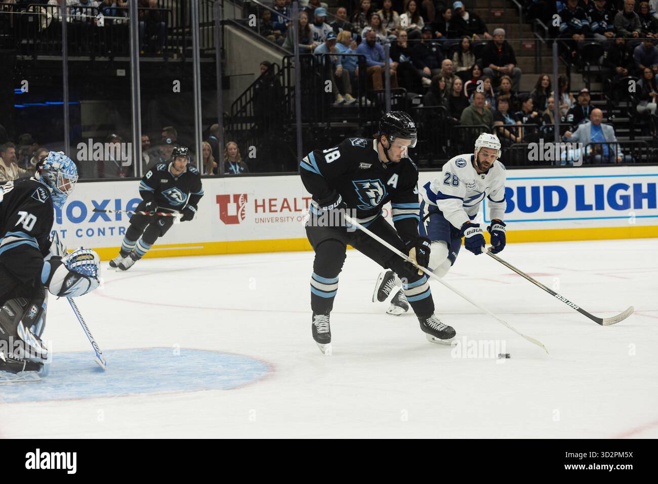 Utah Mammoth defenseman Mikhail Sergachev (98) moves the puck against ...