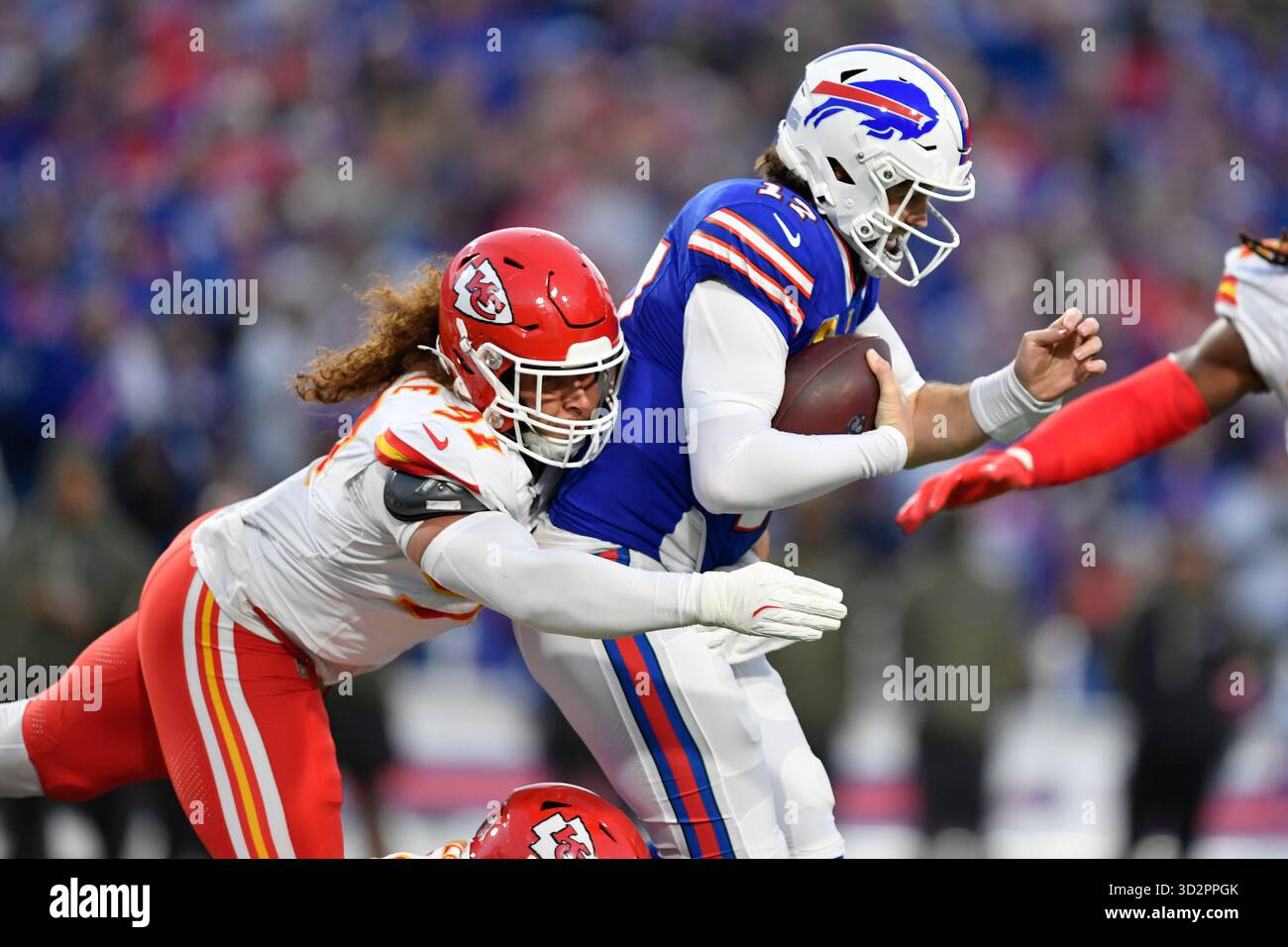 Buffalo Bills quarterback Josh Allen, right, is tackled by Kansas City ...
