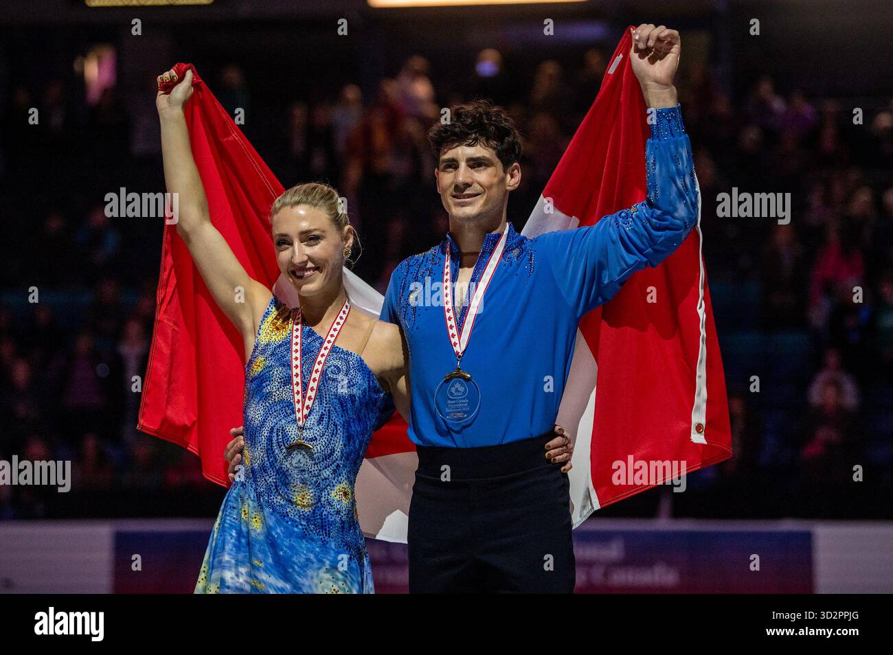 Piper Gilles and Paul Poirier, of Canada, celebrate their gold medals ...