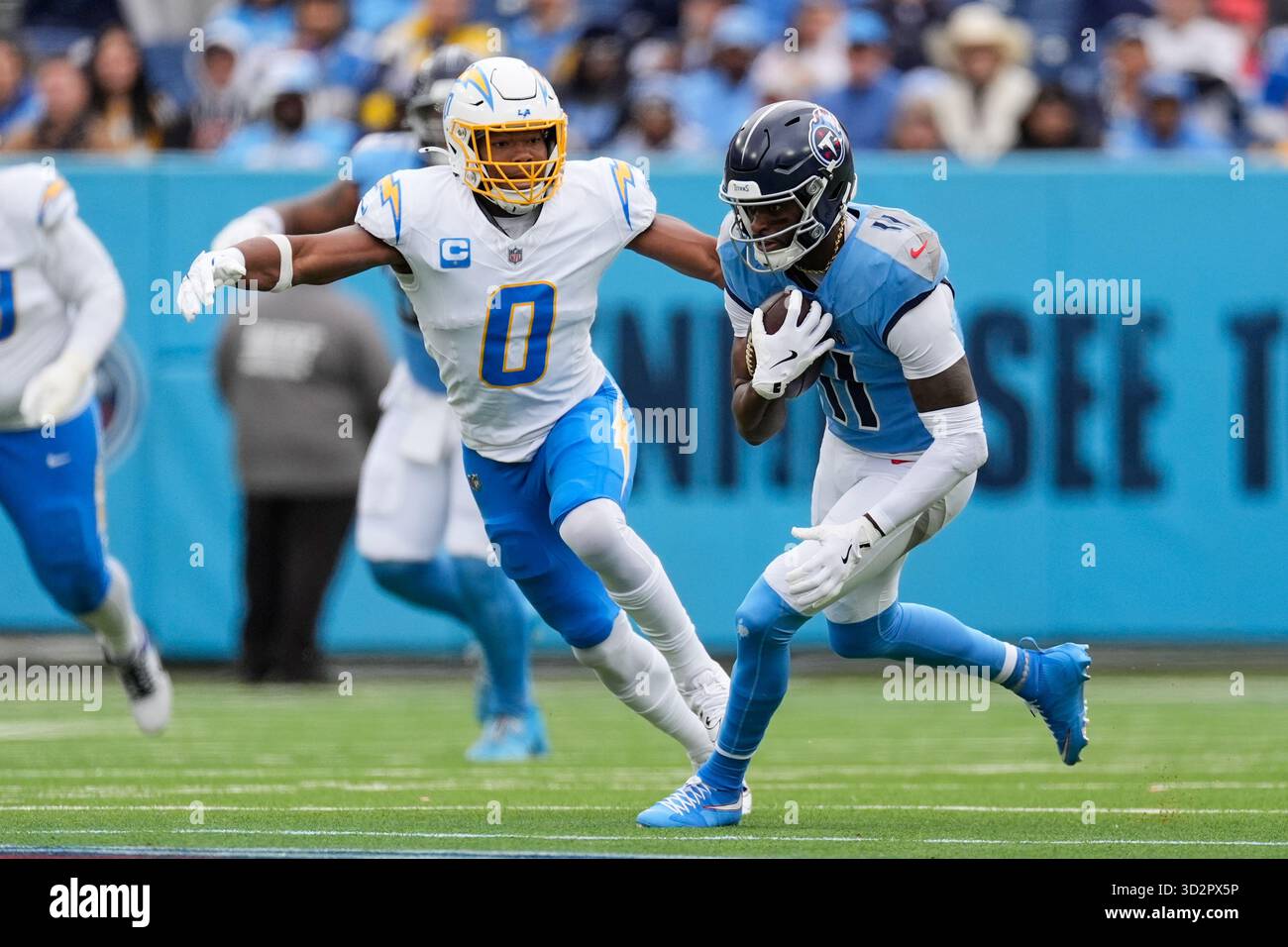 Tennessee Titans wide receiver Van Jefferson (11) runs next to Los ...