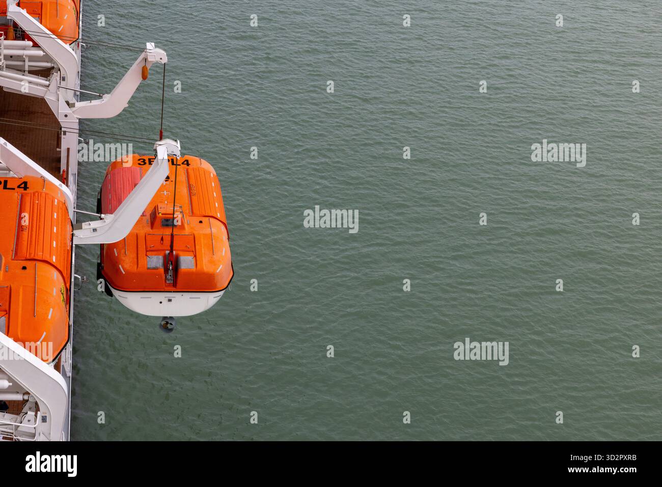 Rescue Boat Being Lowered During Emergency Operation at Sea Stock Photo ...