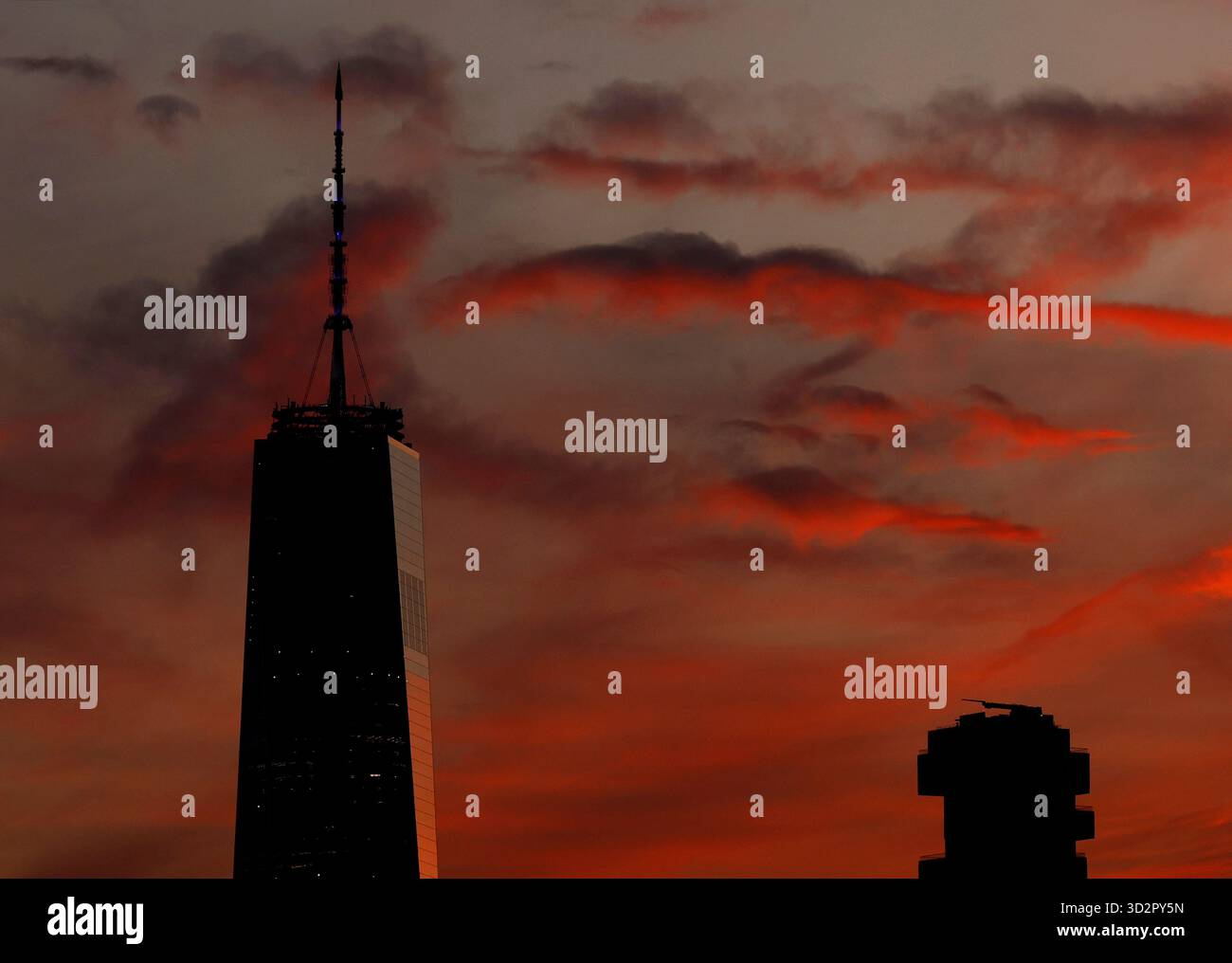 The clouds turn shades of red and orange after the sun sets behind One ...