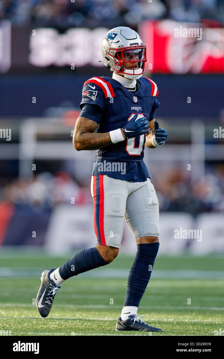 New England Patriots cornerback Christian Gonzalez (0) drops into ...