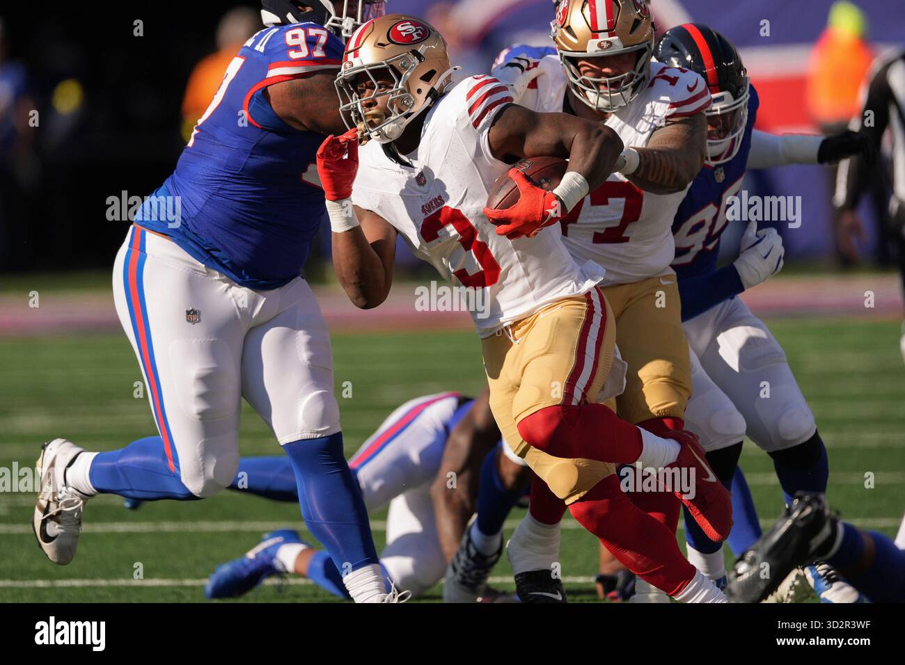 San Francisco 49ers running back Brian Robinson Jr. carries the ball against the New York Giants ...