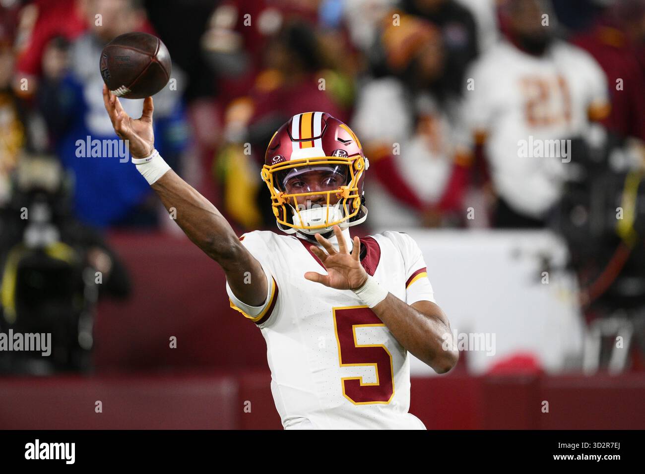 Washington Commanders quarterback Jayden Daniels (5) warming up before ...