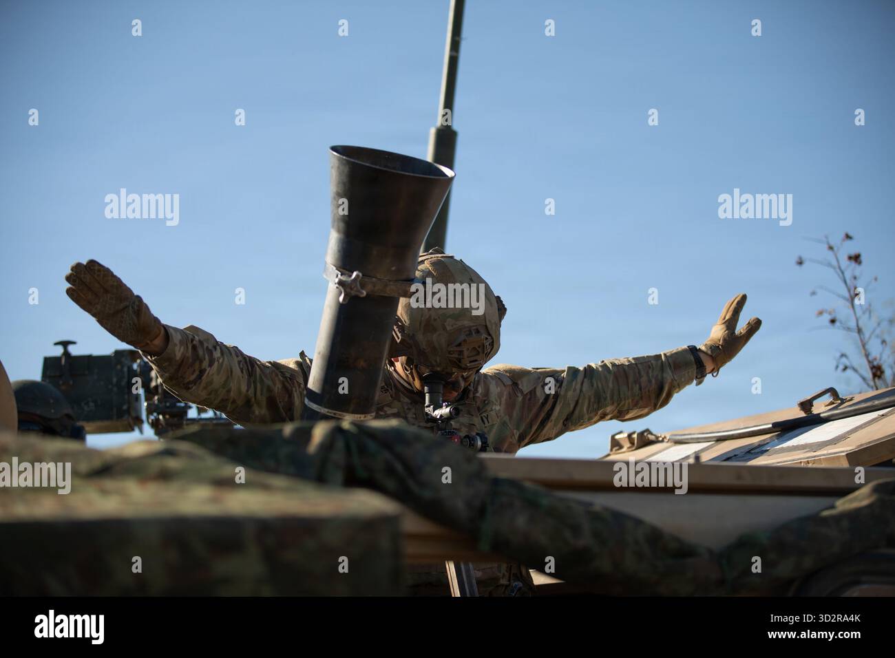 U.S. Army Spc. Juan Guzman, a gunner assigned to Headquarters and ...