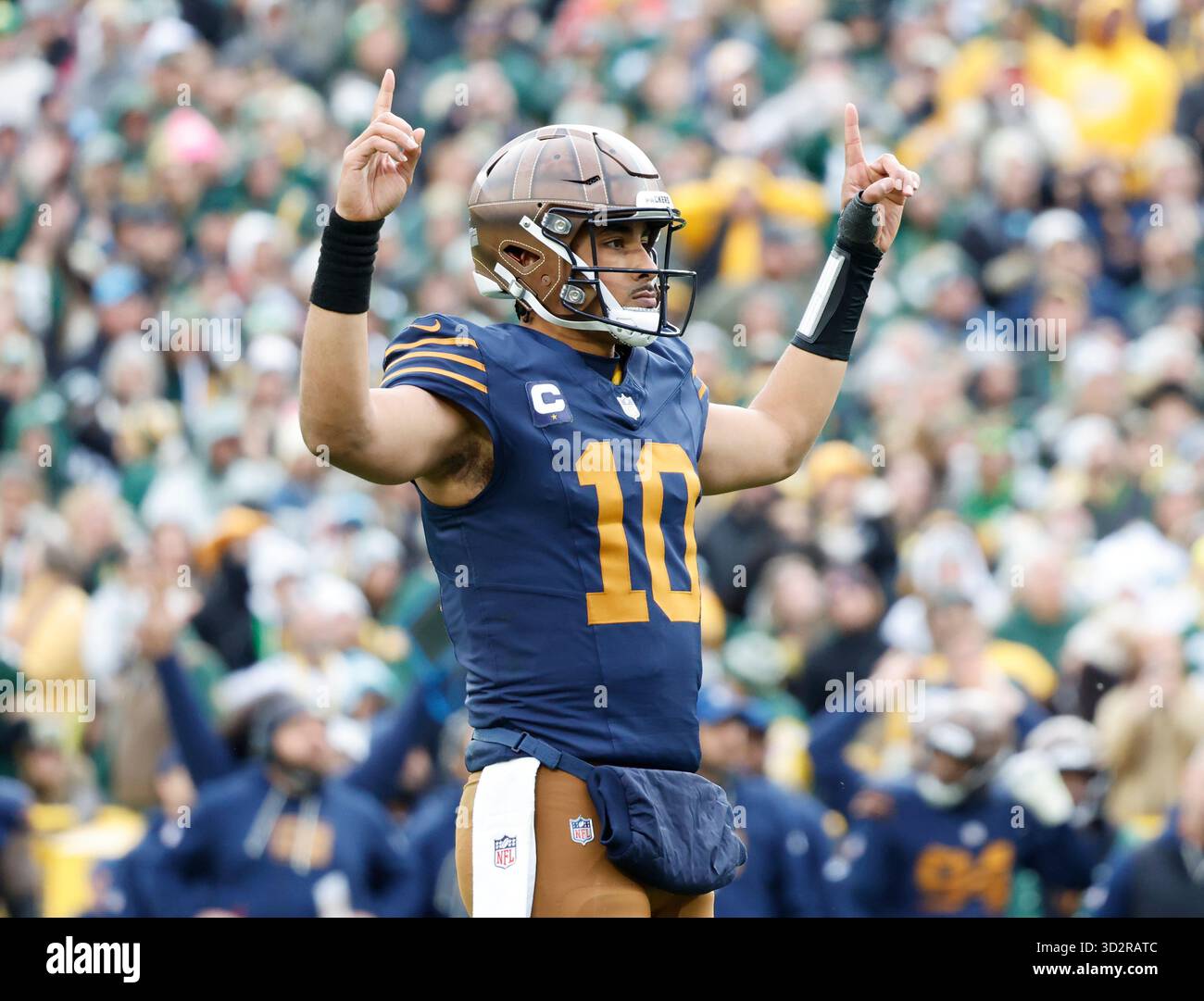 Green Bay Packers quarterback Jordan Love (10) signals a touchdown ...