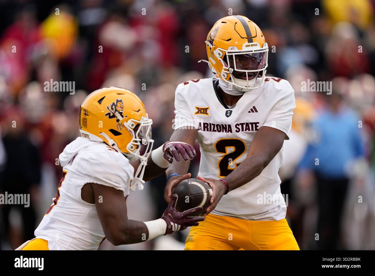 Arizona State quarterback Jeff Sims (2) hands the ball off to running ...