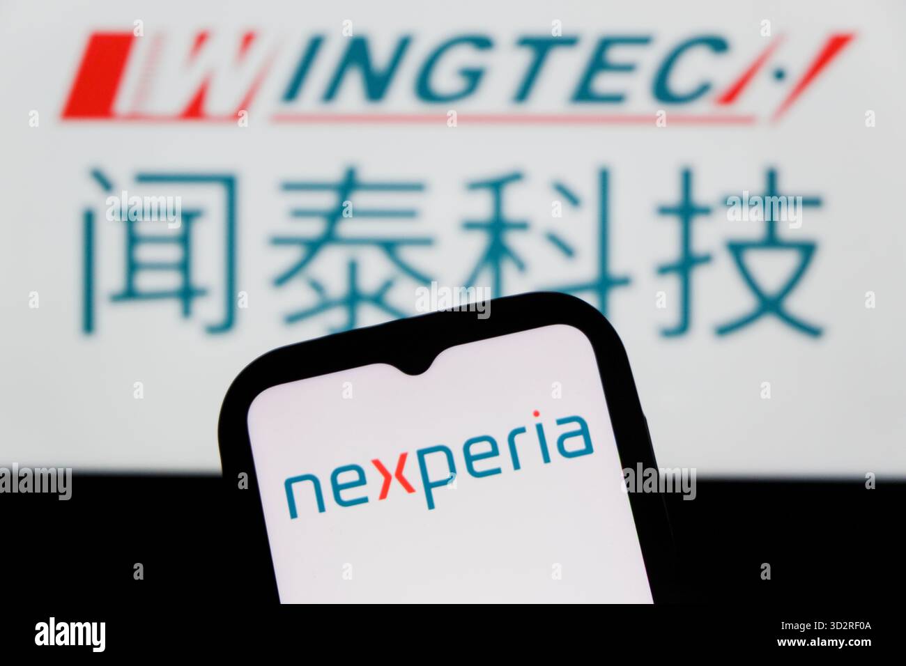 In this photo illustration, a Nexperia logo is displayed on a ...