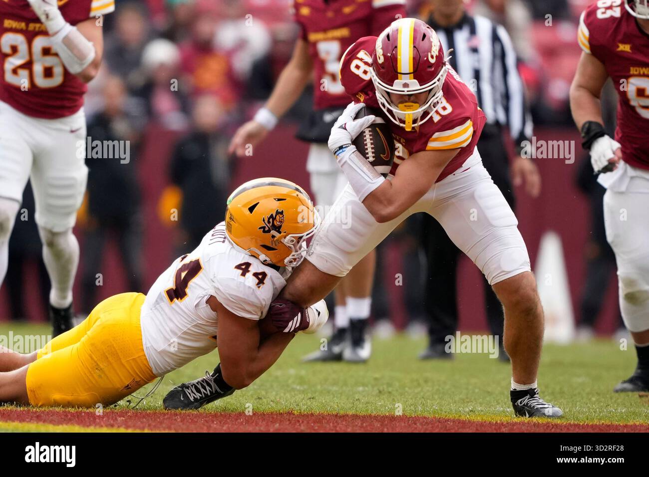 Iowa State tight end Benjamin Brahmer (18) tries to break a tackle by ...