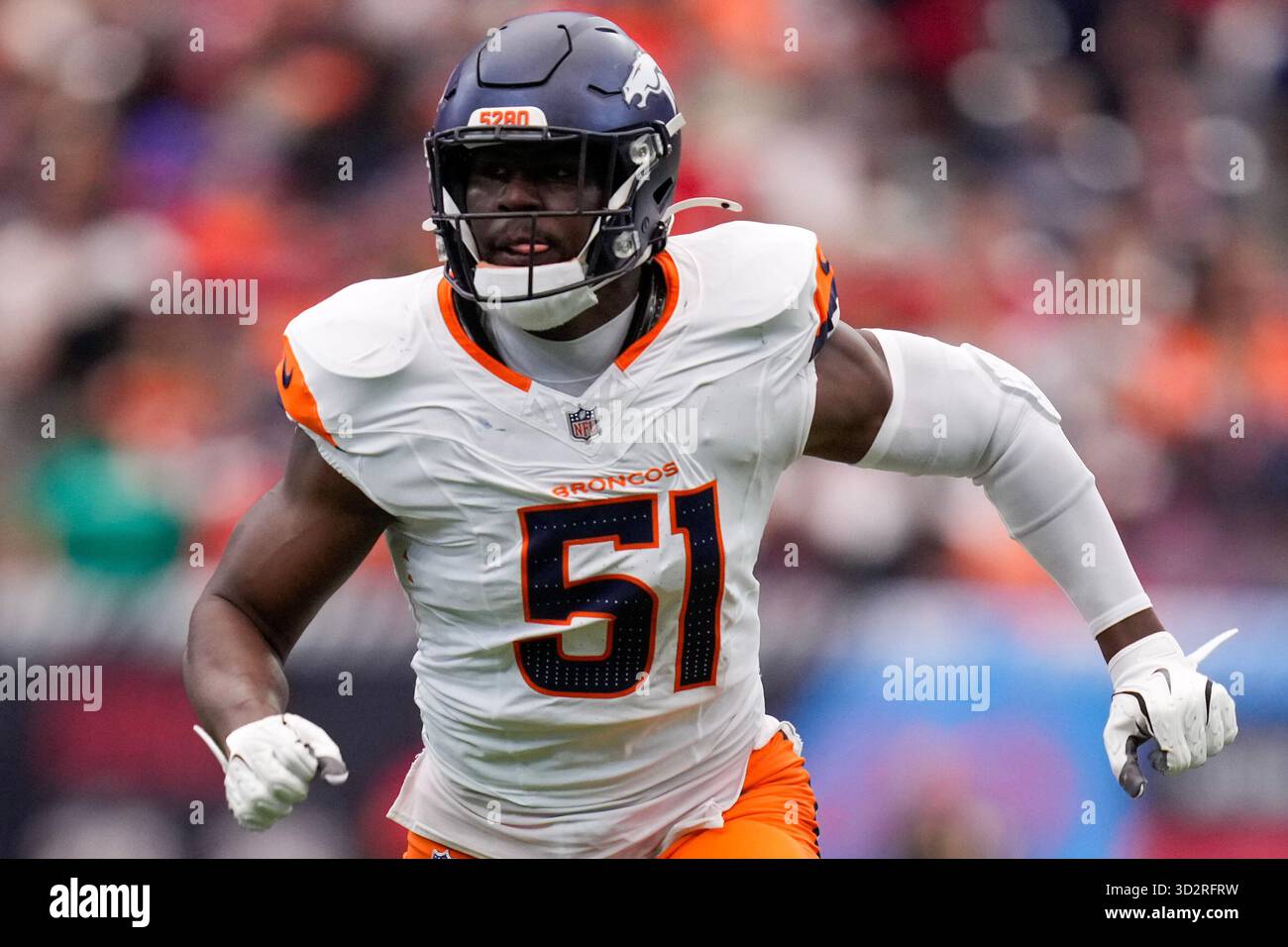 Denver Broncos linebacker Que Robinson (51) plays against the Houston ...