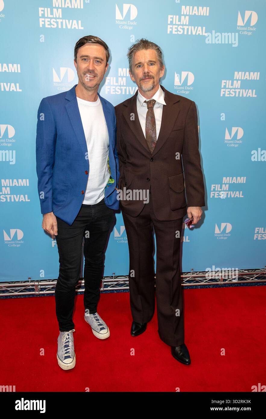 MIAMI, FLORIDA - NOVEMBER 02: James Woolley and Ethan Hawke attend the ...