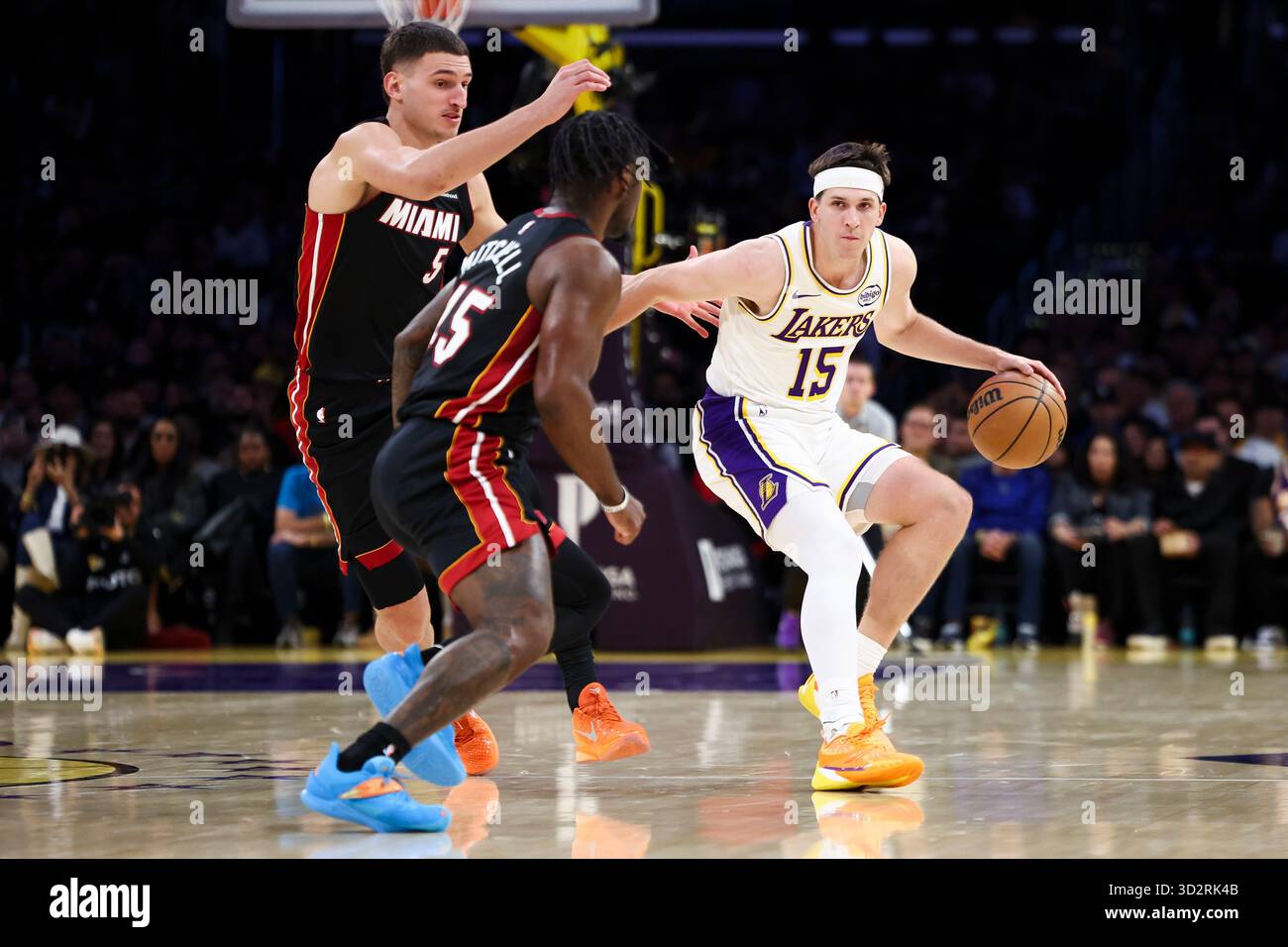 Los Angeles Lakers guard Austin Reaves (15) dribbles against Miami Heat ...