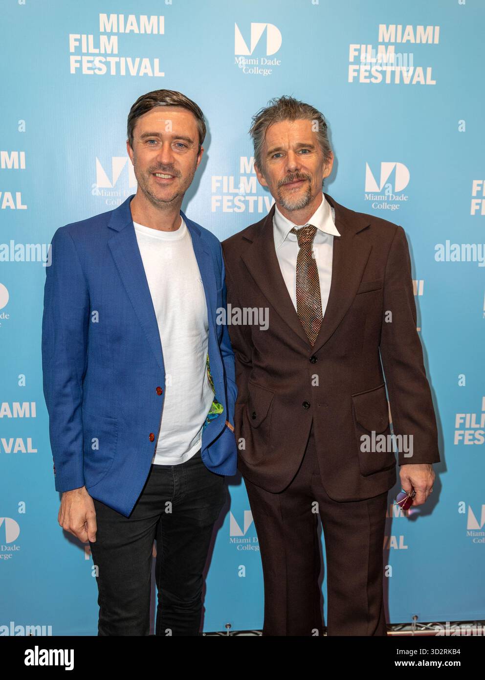 MIAMI, FLORIDA - NOVEMBER 02: James Woolley and Ethan Hawke attend the ...