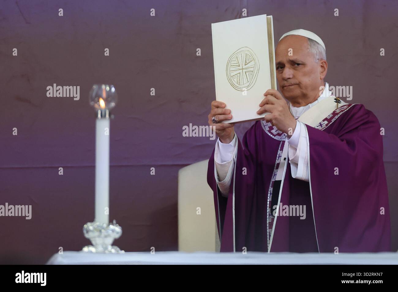 The pontiff displays the book of the holy scriptures. Pope Leo XIV ...