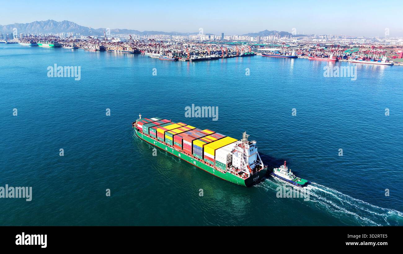 A cargo ship loaded with containers enters Qingdao Port, Qingdao City ...