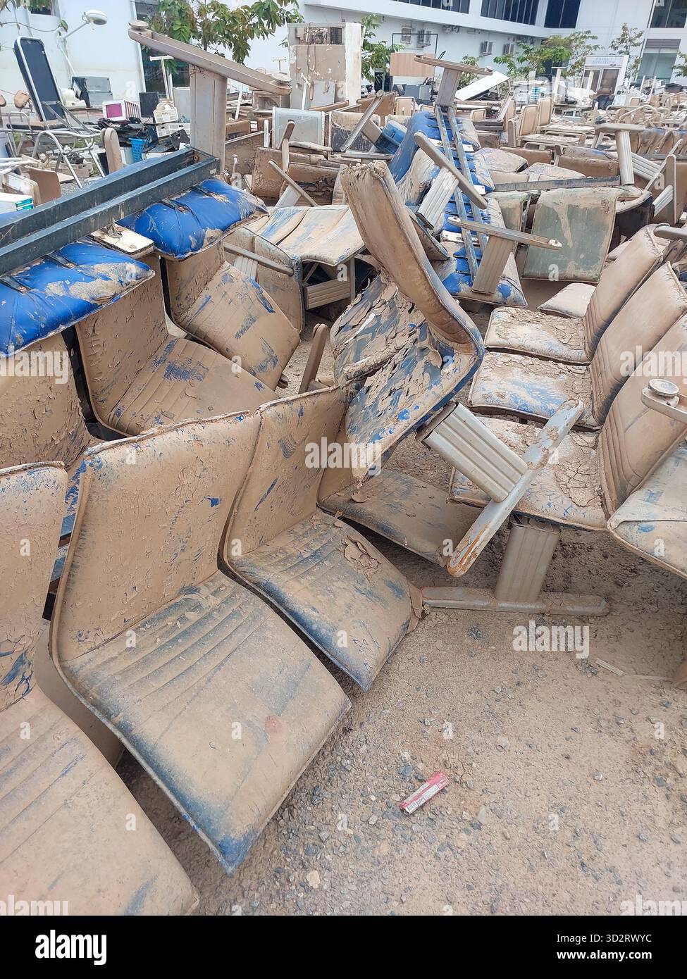 Pile of damaged, muddy chairs shows devastating aftermath of natural ...