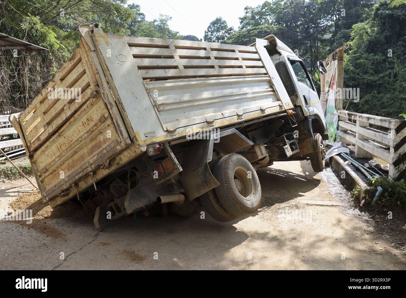 Leaning dump truck look hazardous and unstable Stock Photo - Alamy
