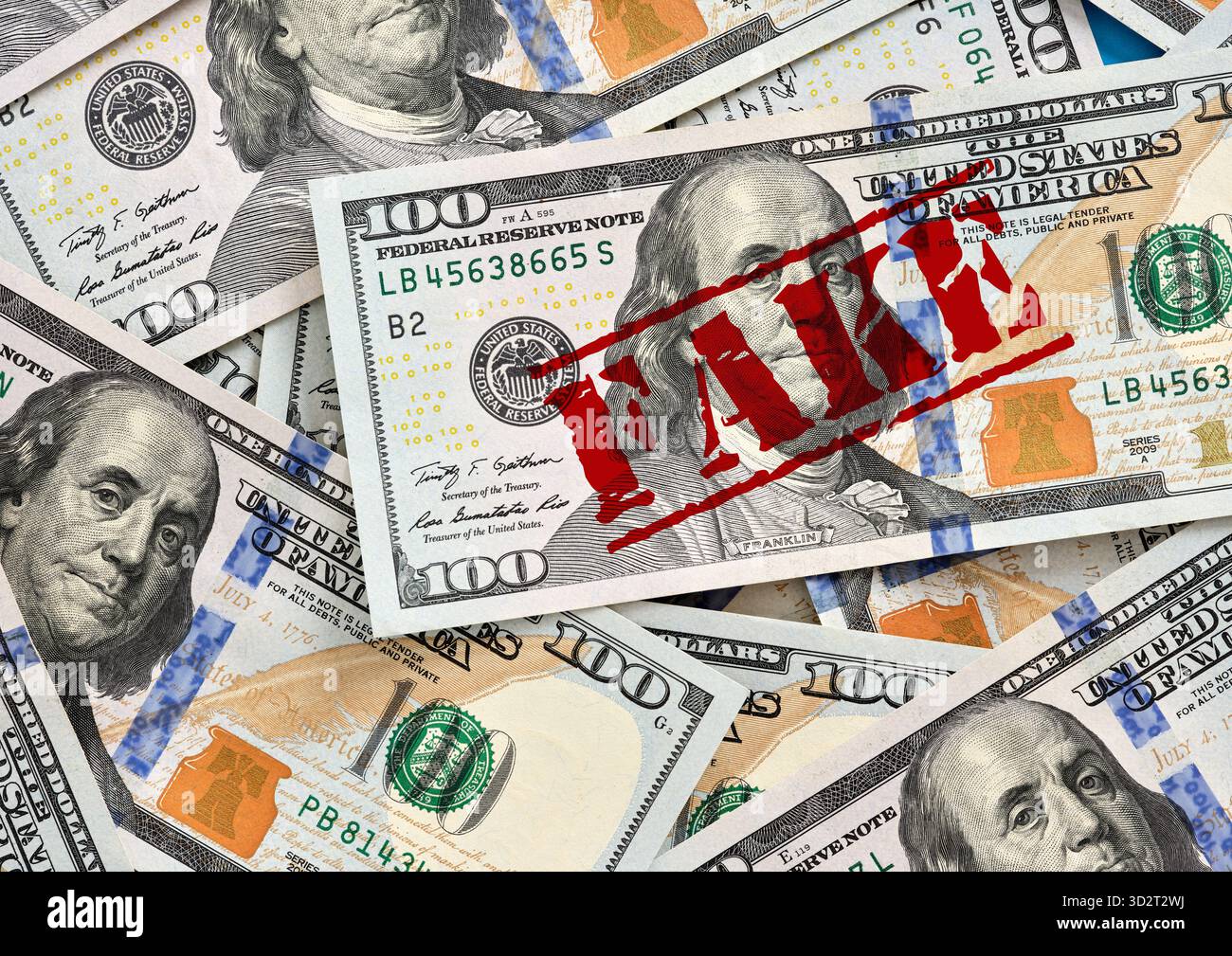 Concept of counterfeit money featuring one hundred dollar bills marked ...