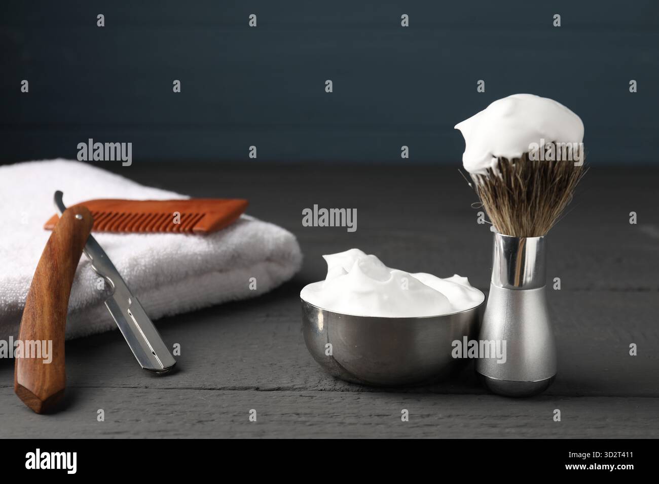 Different barber's tools on grey wooden table, closeup Stock Photo - Alamy