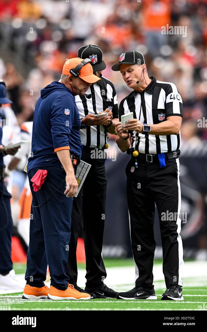 Denver Broncos head coach Sean Payton speaks with line judge Brian ...