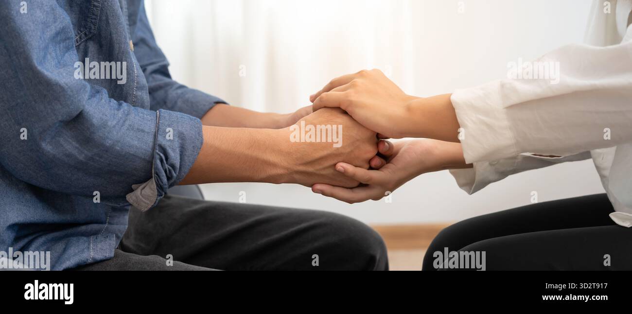 psychiatrist hold hand support each while discussing family issues ...