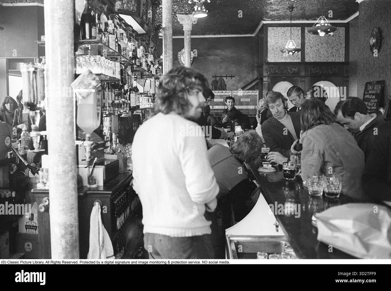 London pub in the 1970s. The London pub Bierritz and a group of men ...