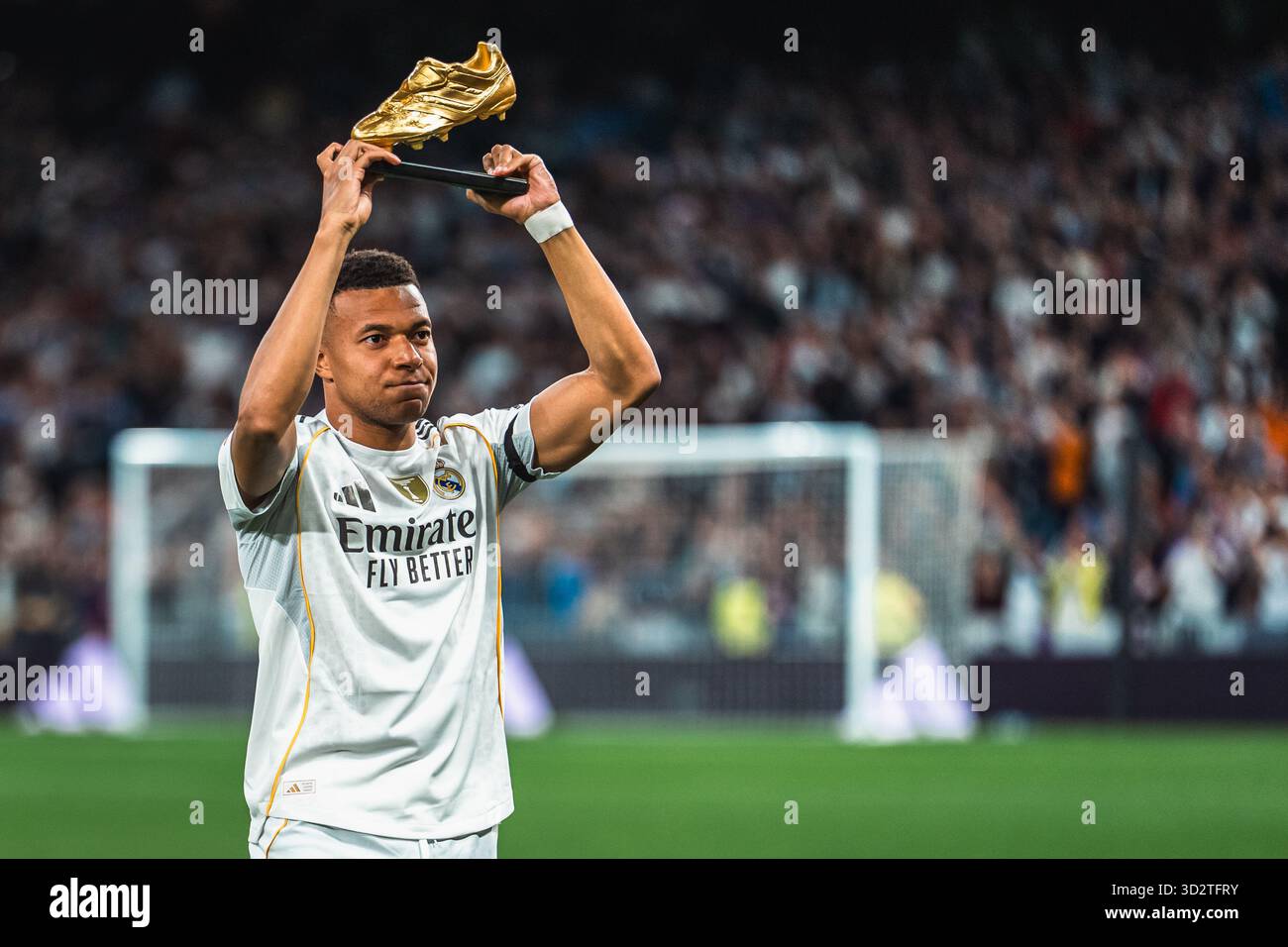 Kilyan Mbappe of Real Madrid showing the golden boot to the fans during ...