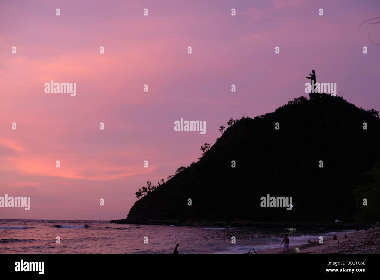 Cristo Rei of Dili Statue on the top of the hill with sunset background ...