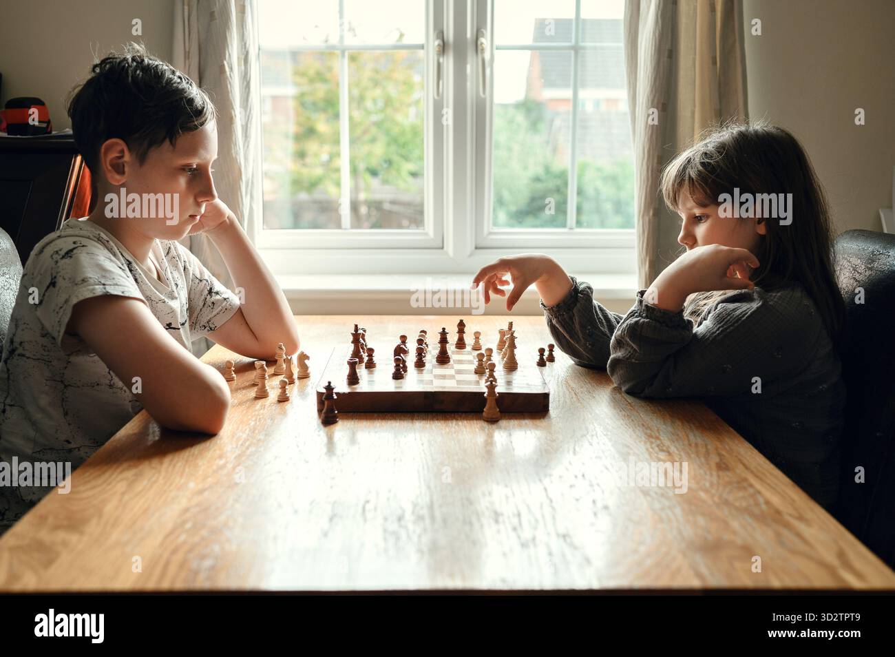 Children play chess on hi-res stock photography and images - Alamy