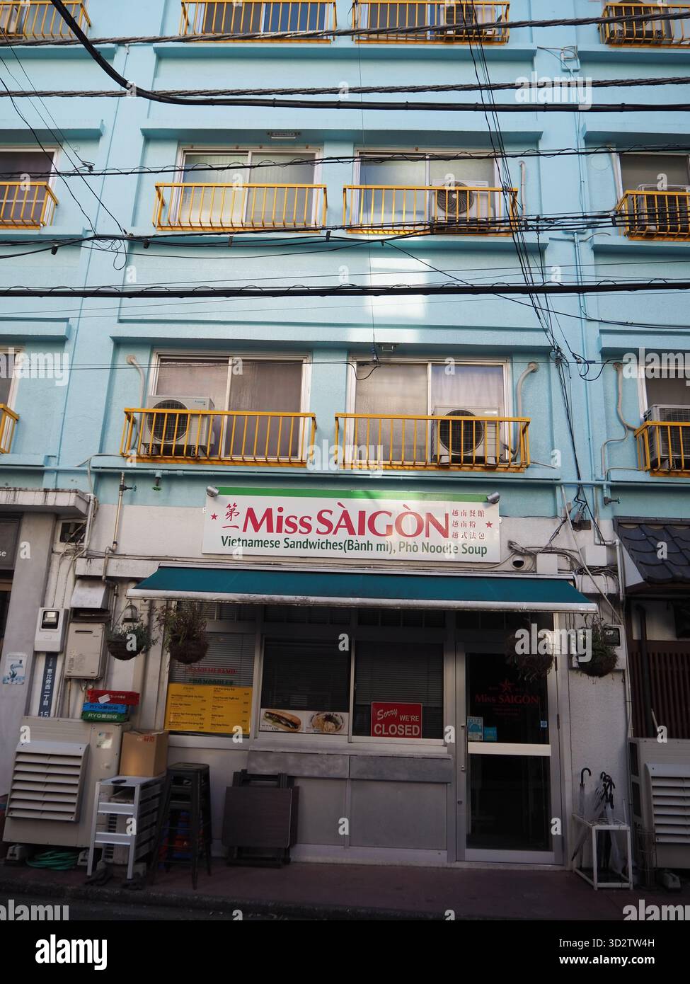 Miss Saigon Vietnamese restaurant in a light blue building with yellow ...