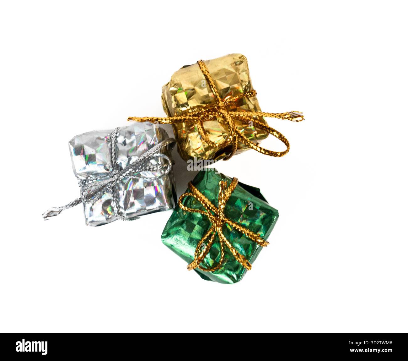 Mini gift boxes wrapped in shiny foil paper, isolated on white. Perfect ...