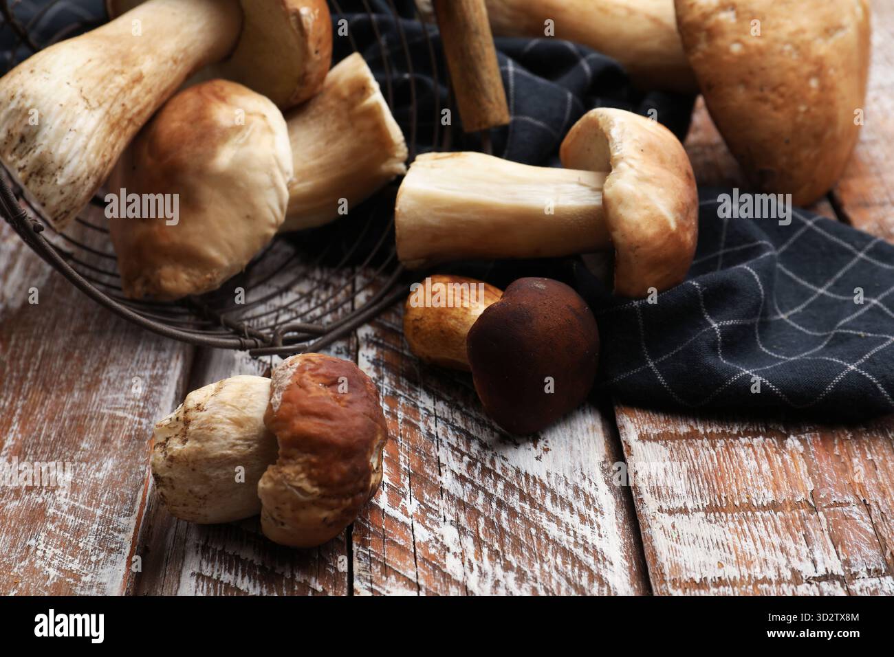 Fresh porcini mushrooms on wooden table, closeup Stock Photo - Alamy