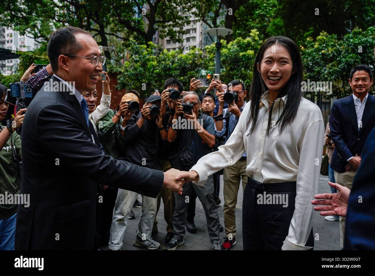 Chairman of Sino Group Daryl Ng Win-kong shaking the hand of Vivian ...