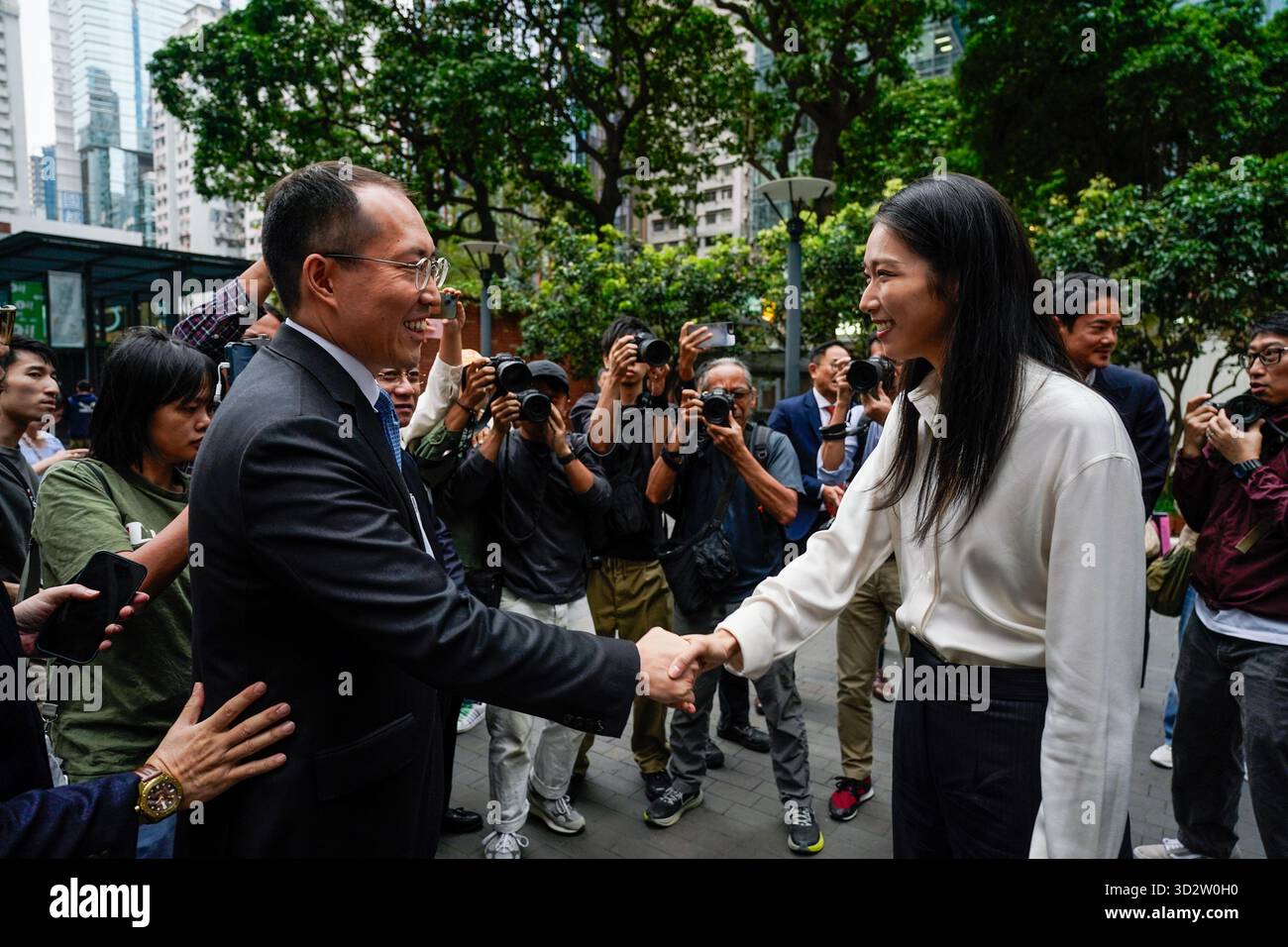 Chairman of Sino Group Daryl Ng Win-kong shaking the hand of Vivian ...