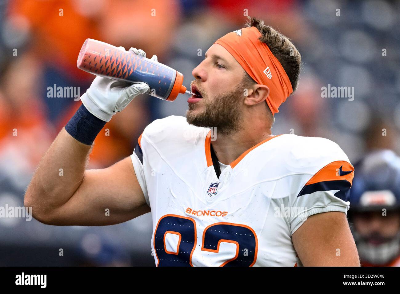 Denver Broncos tight end Adam Trautman (82) drinks from a Gatorade ...