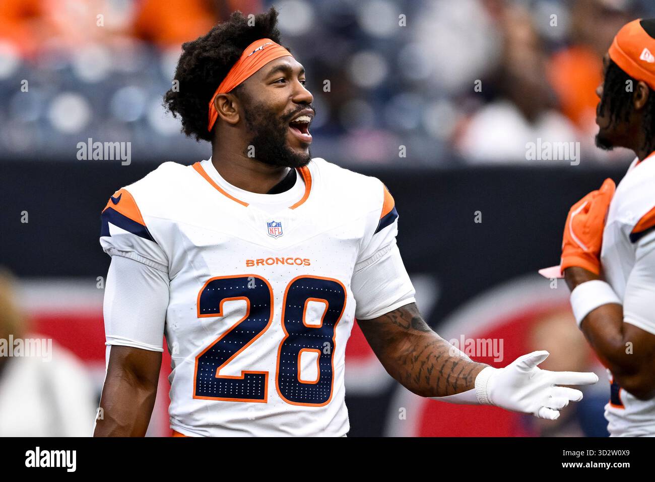 Denver Broncos running back Tyler Badie (28) reacts during warm ups ...