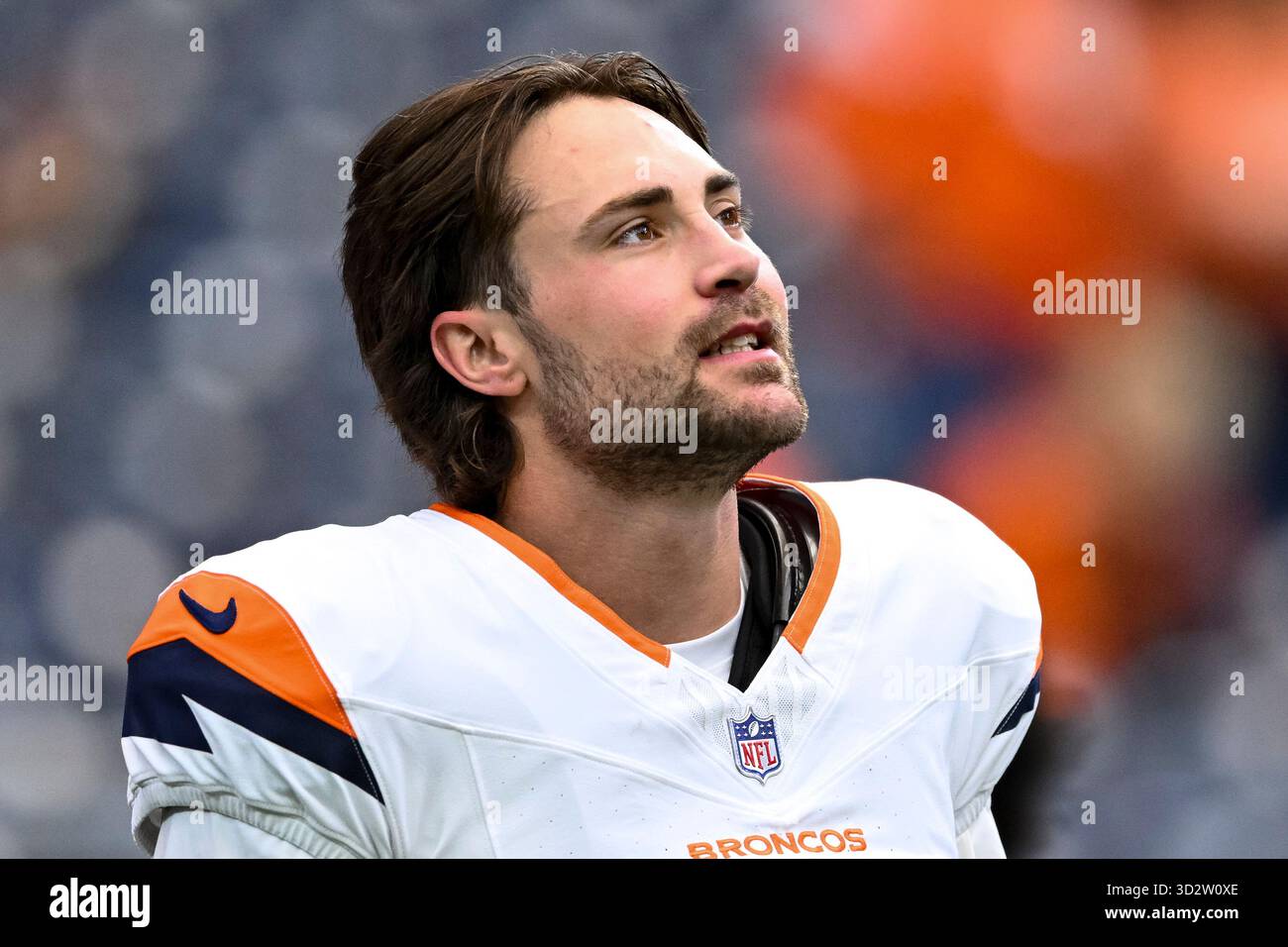 Denver Broncos cornerback Riley Moss (21) looks on during warm ups ...