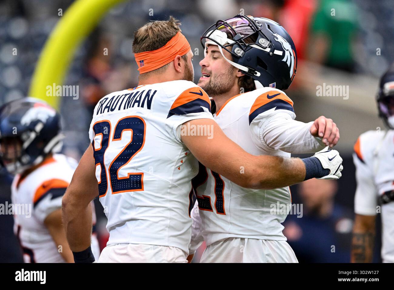 Denver Broncos cornerback Riley Moss (21) greets tight end Adam ...