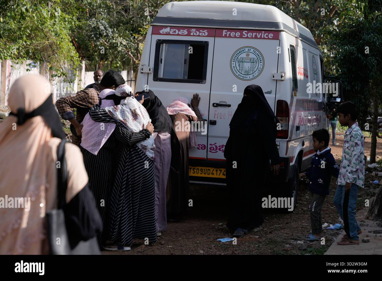 Relatives mourn at the ambulance carrying a victim of the fatal ...