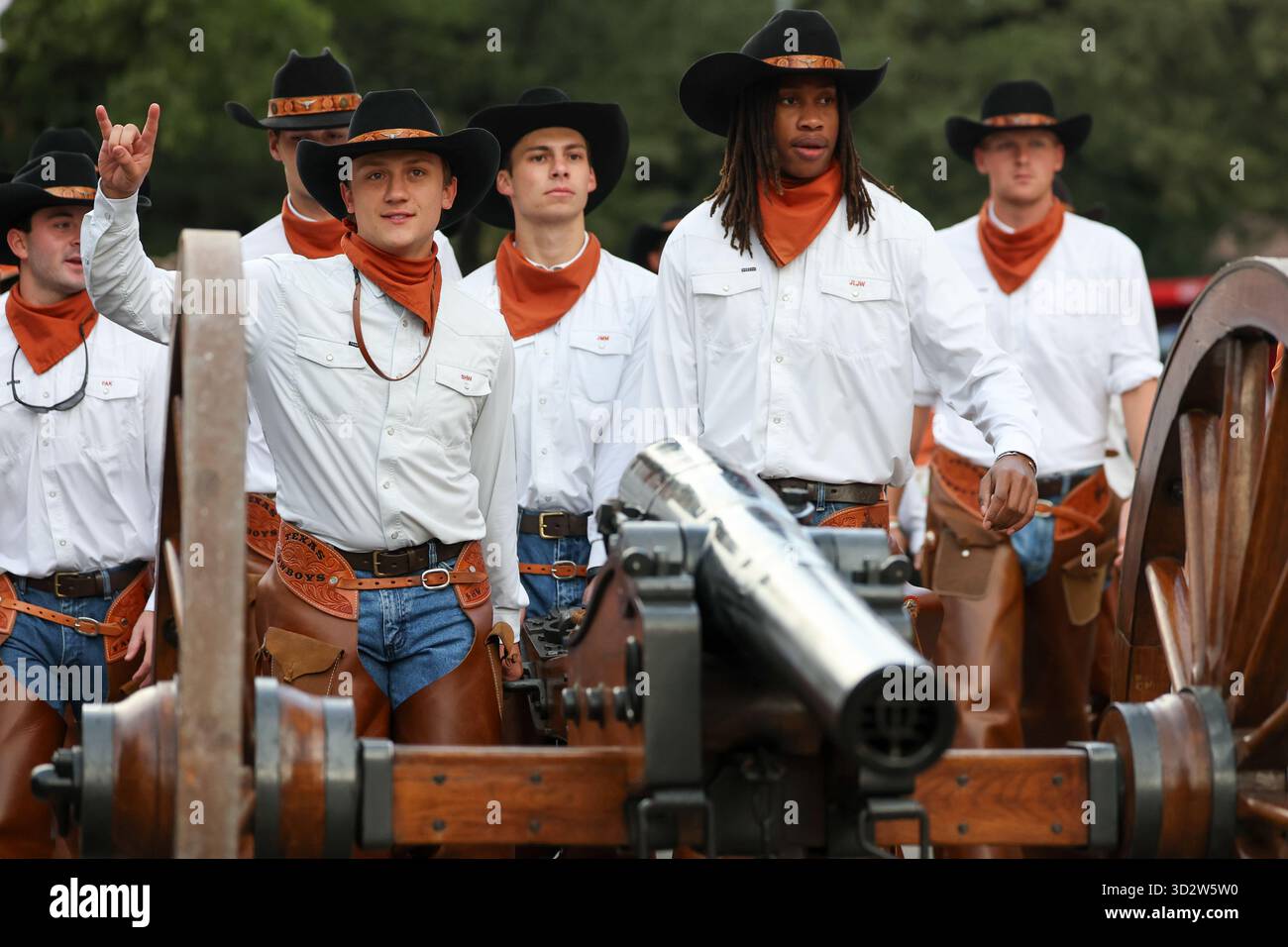 AUSTIN, TX - NOVEMBER 01: Texas Cowboys walk Smokey the Cannon into the ...