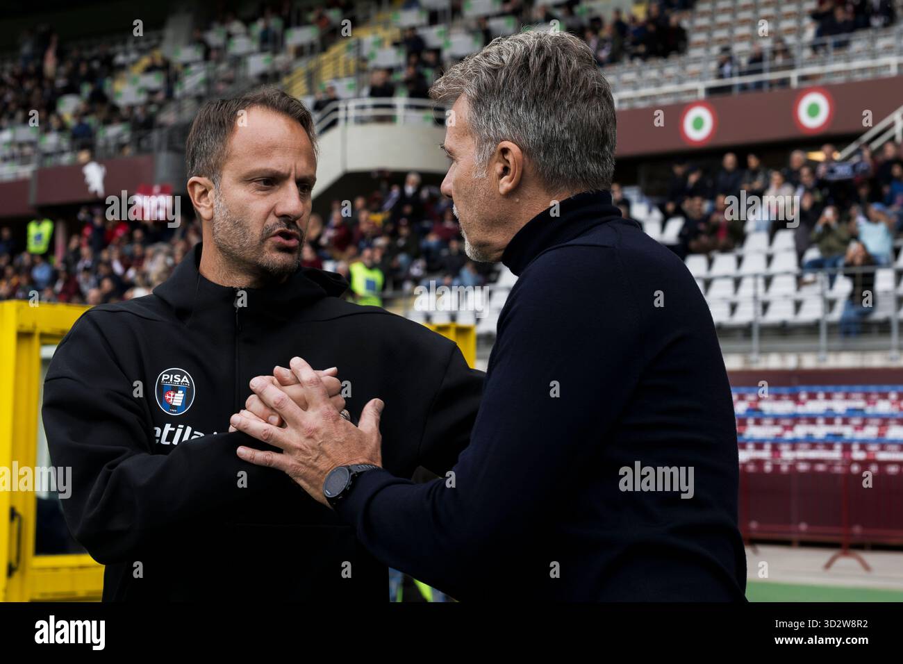 Marco Baroni, head coach of Torino FC, shakes hands with Alberto ...