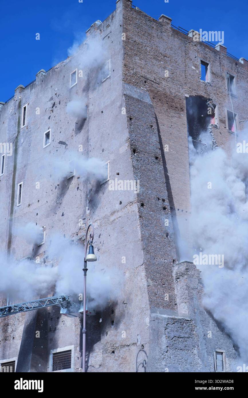 Firefighters work to rescue a construction worker from under the debris ...