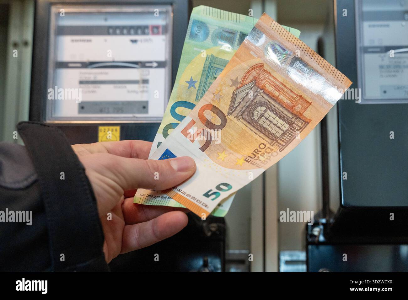 Bavaria, Germany - November 3, 2025: Euro notes held directly in front ...