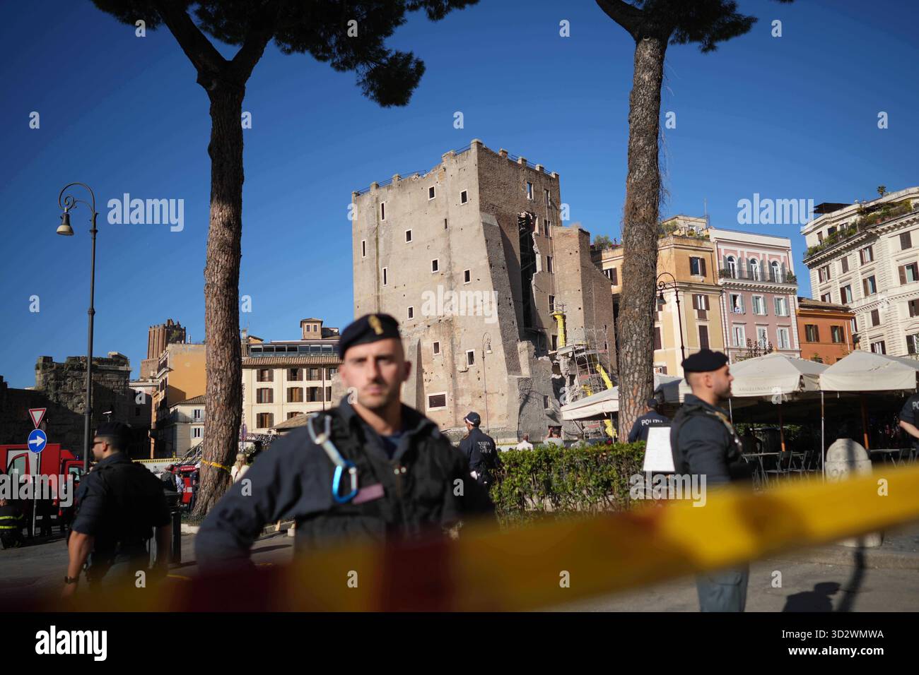 Police officers patrol the medieval tower Torre dei Conti area near the ...