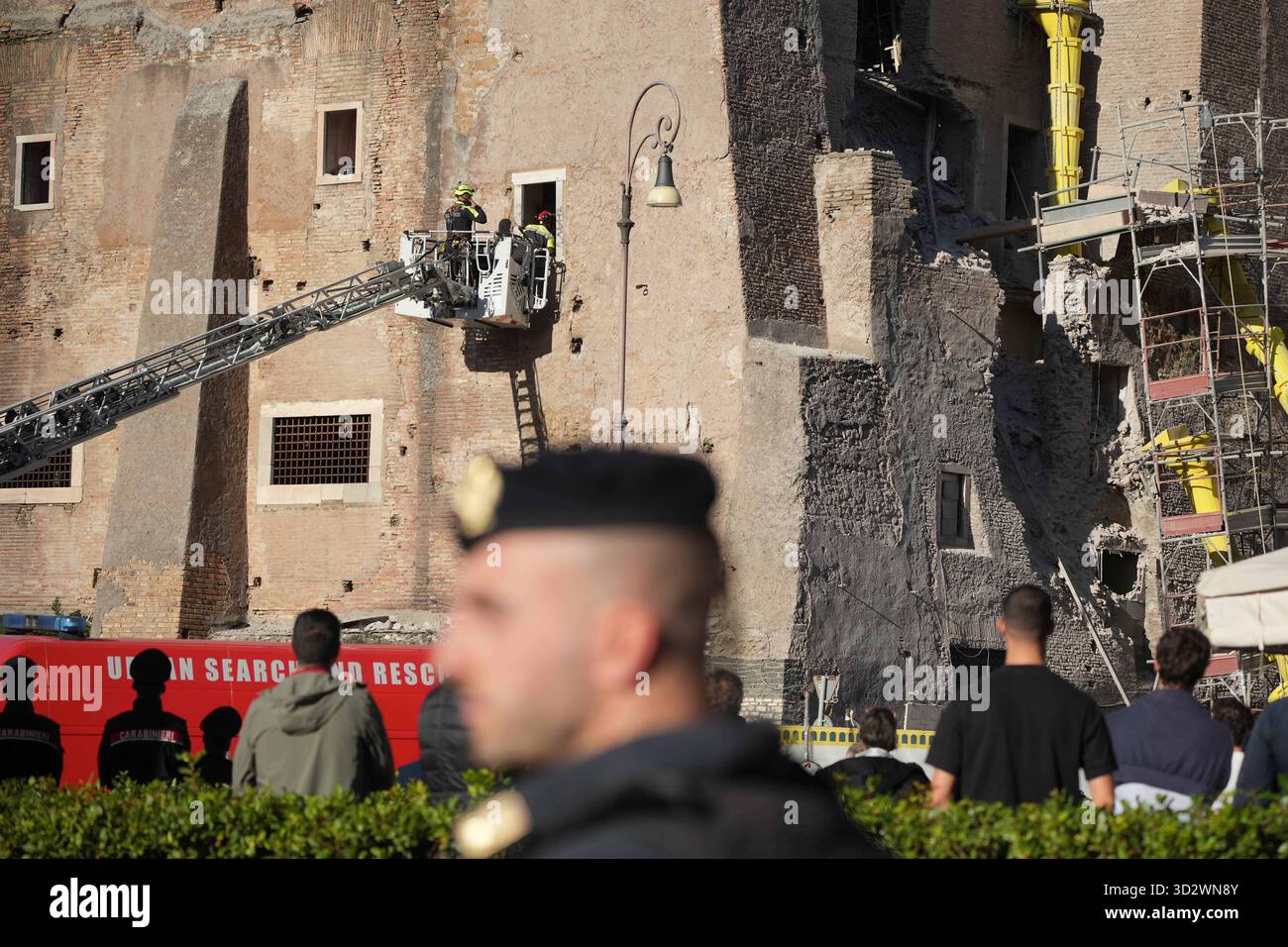 Firefighters work on a medieval tower Torre dei Conti near the Roman ...
