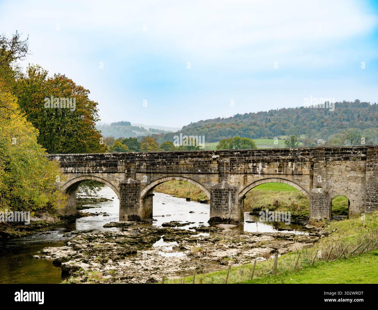 Historic stone bridge spanning the River Wharfe near Grassington, North ...