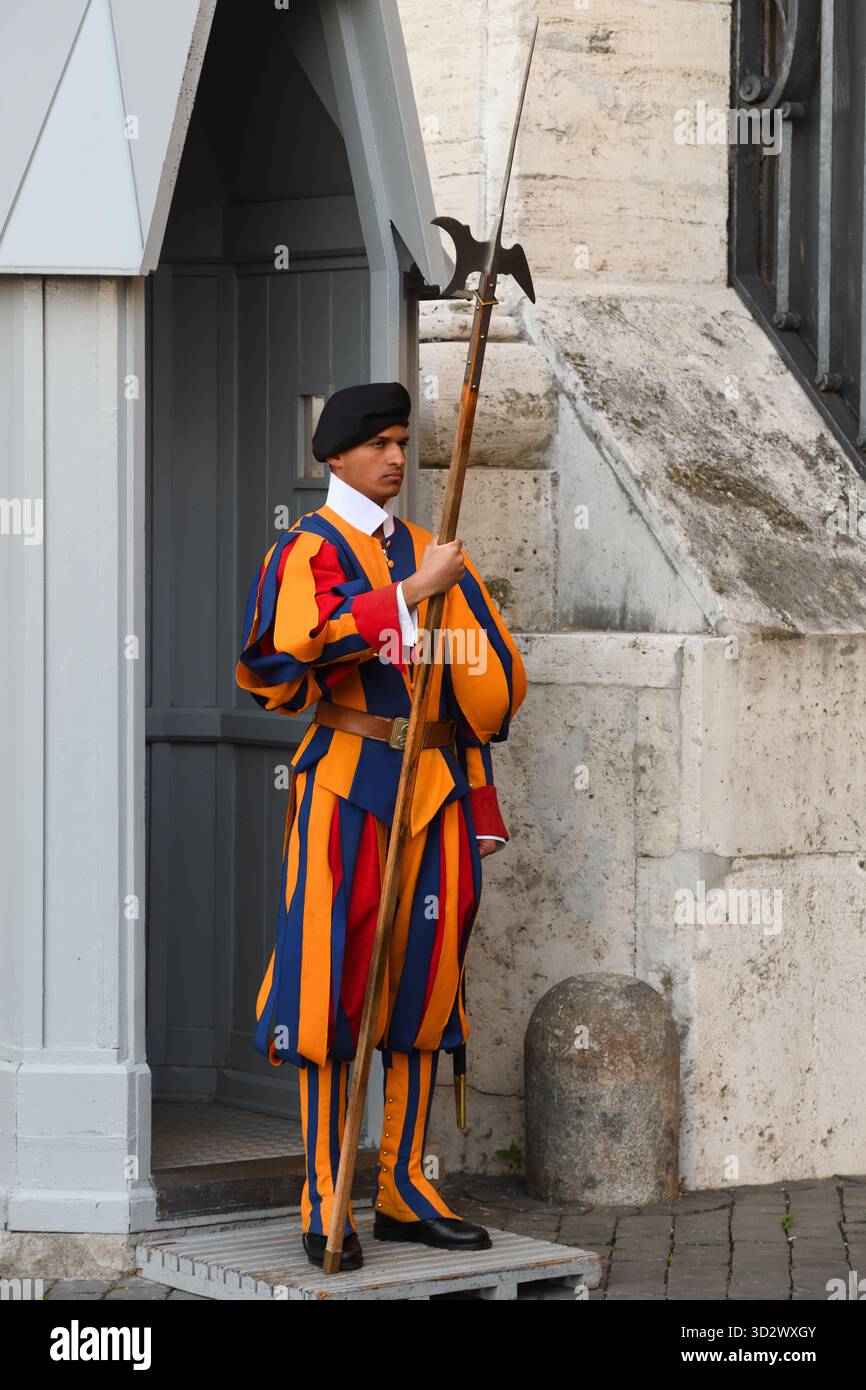 A Pontifical Swiss Guard in ceremonial uniform stands guard at Saint ...