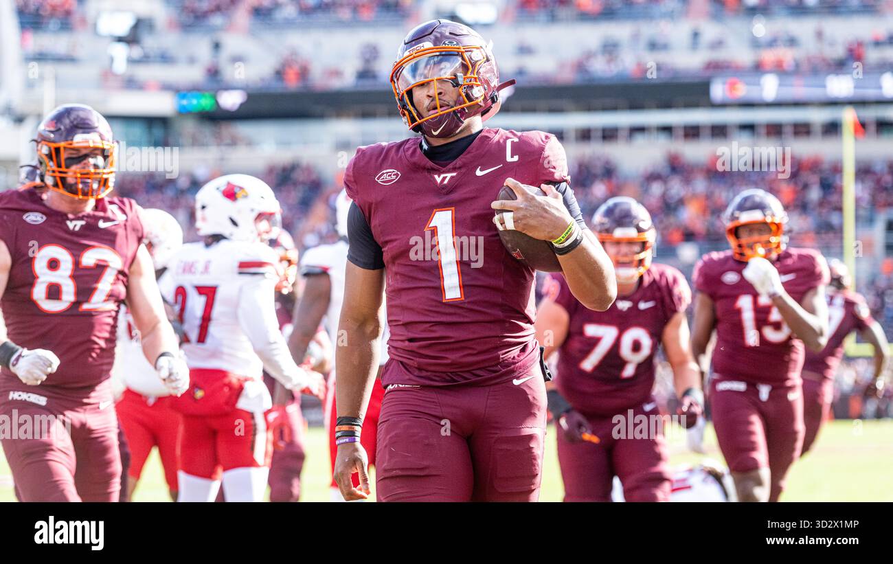 Virginia Tech quarterback Kyron Drones (1) runs in for a touchdown ...